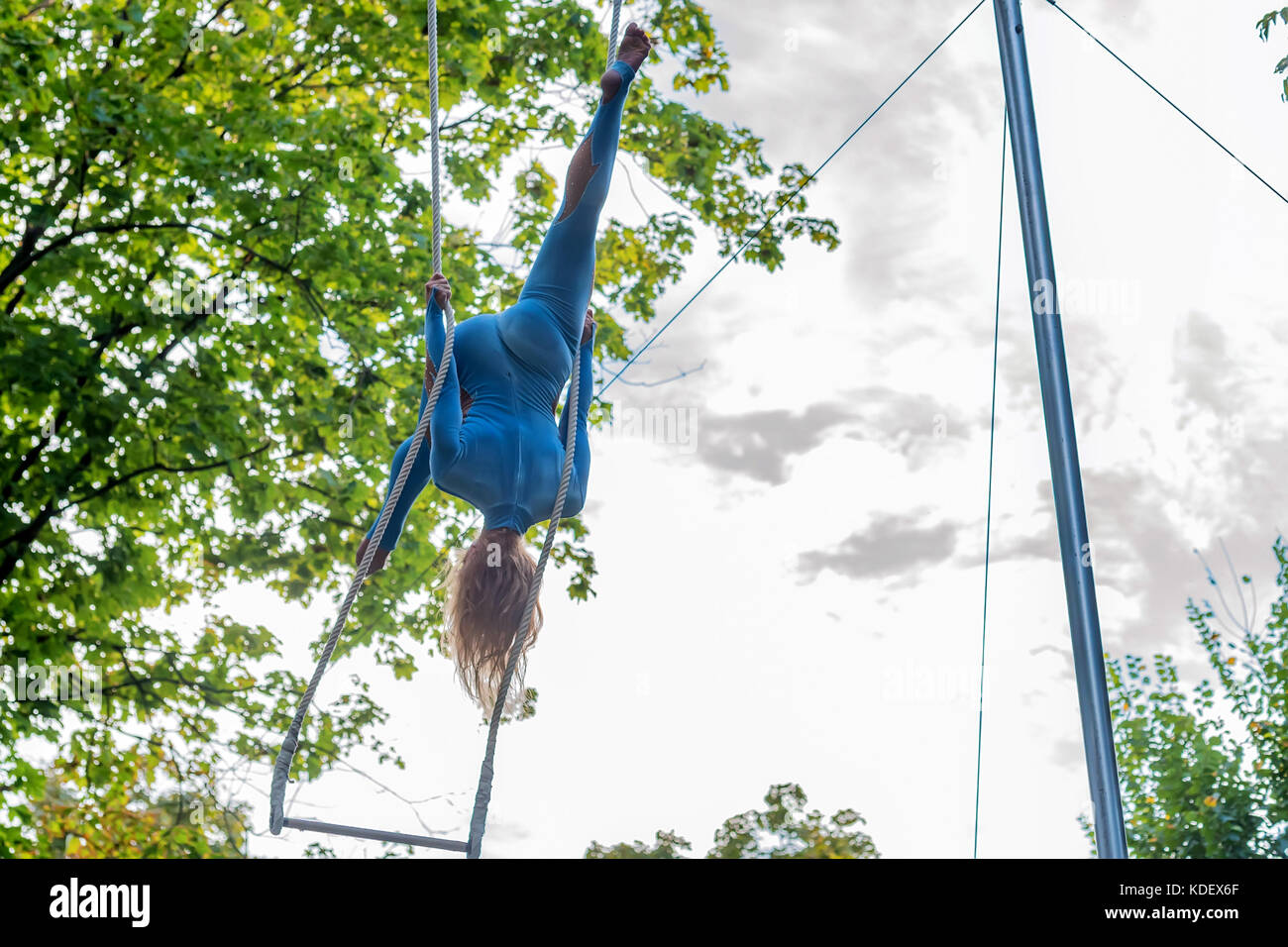 Back view young attractive female trapeze artist Stock Photo - Alamy