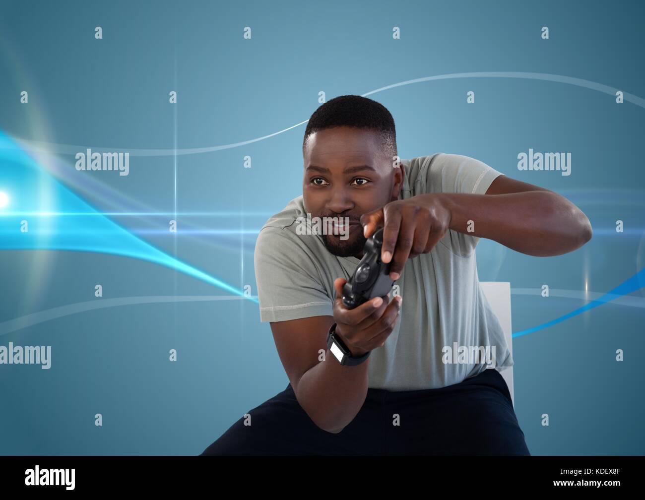 Digital composite of man playing with computer game controller with ...