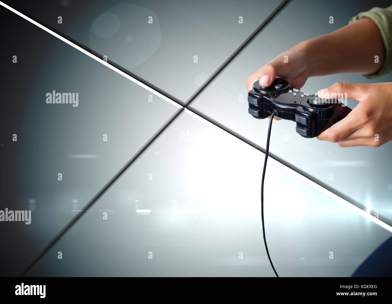 Digital composite of Hands playing with computer game controller with ...