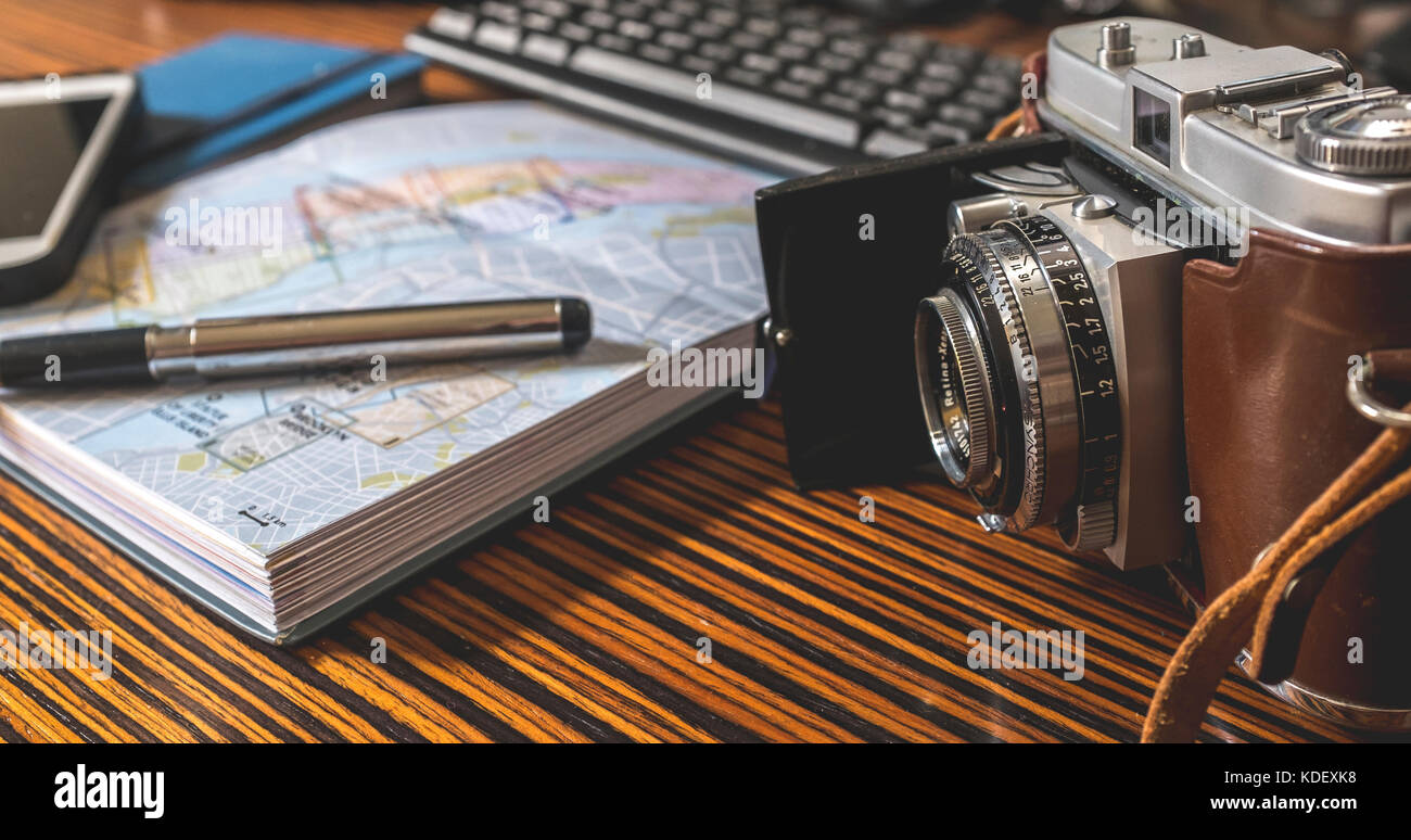 tourist's travel tools with retro style camera Stock Photo - Alamy
