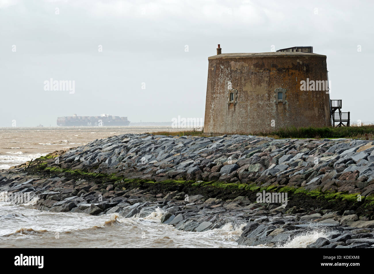 Rock armor protecting a historic Martello Tower from coastal erosion ...