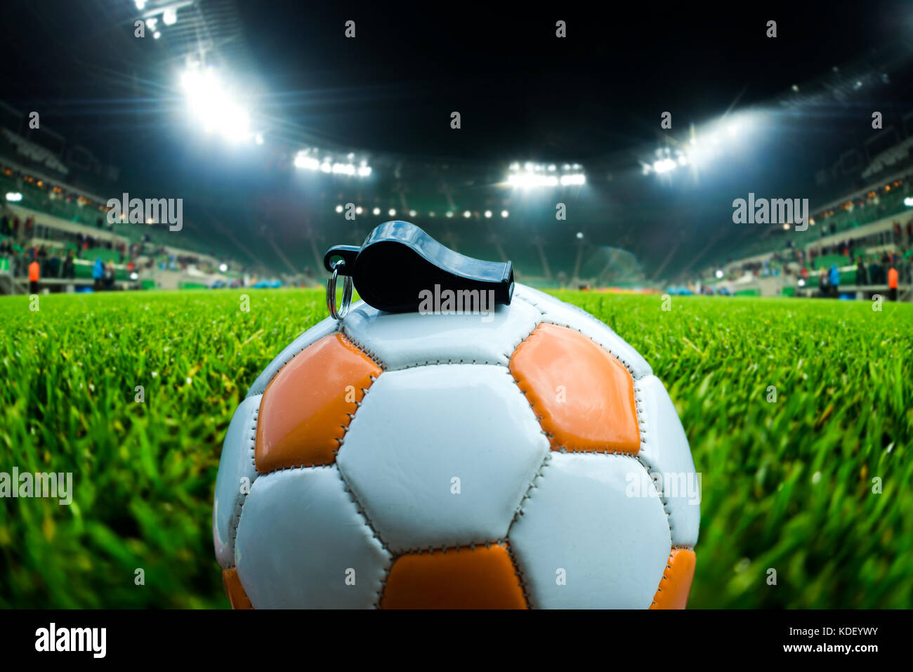 Football ball with whistle on the grass on soccer stadium Stock Photo ...