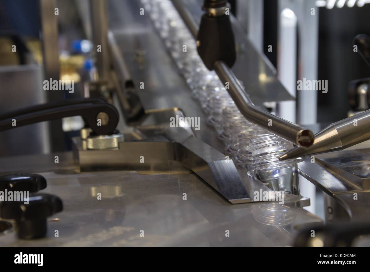 PET Preform in PET bottles blowing. The plastic bottle blowing machine ...