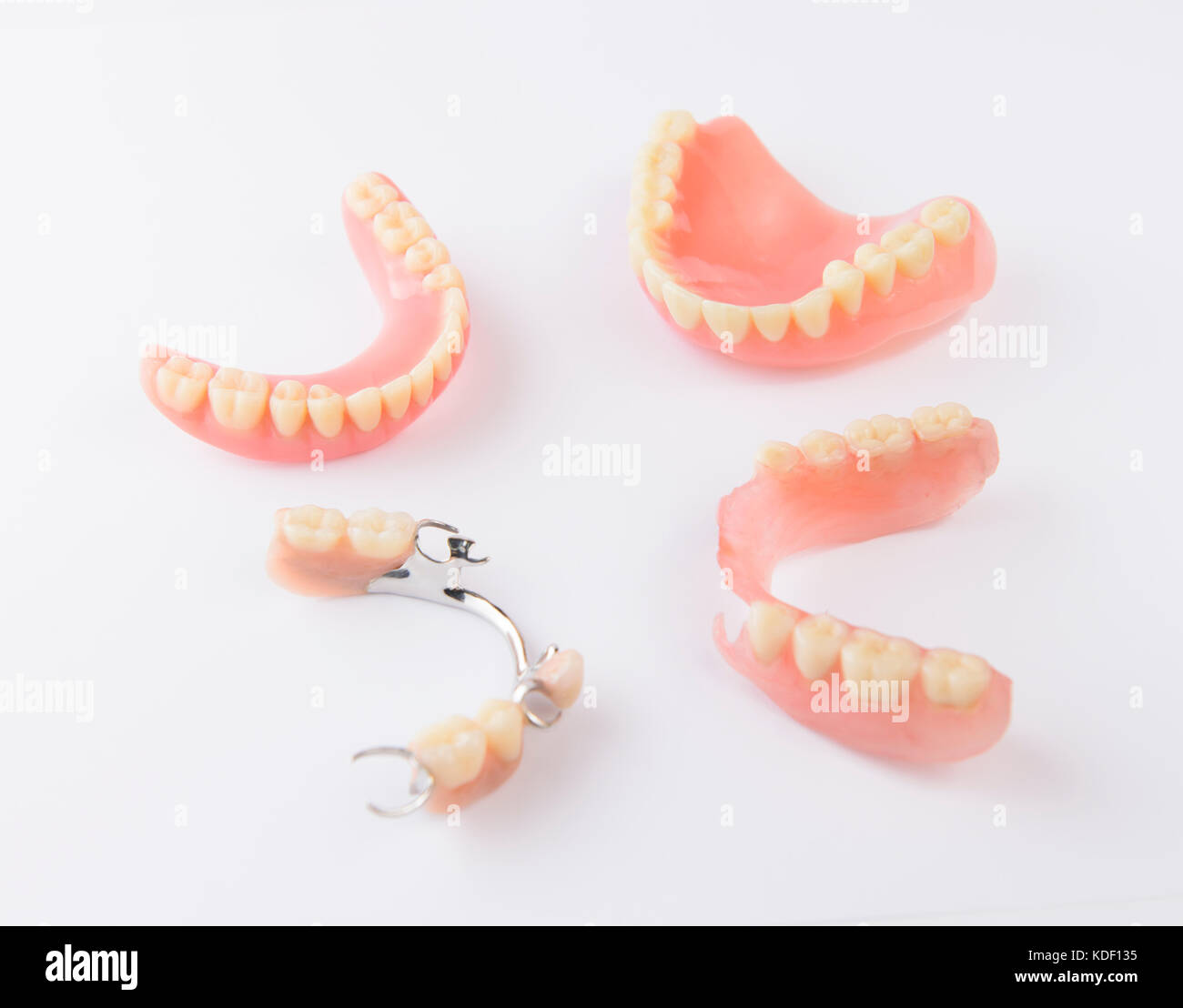 Group of dentures on white background Stock Photo - Alamy