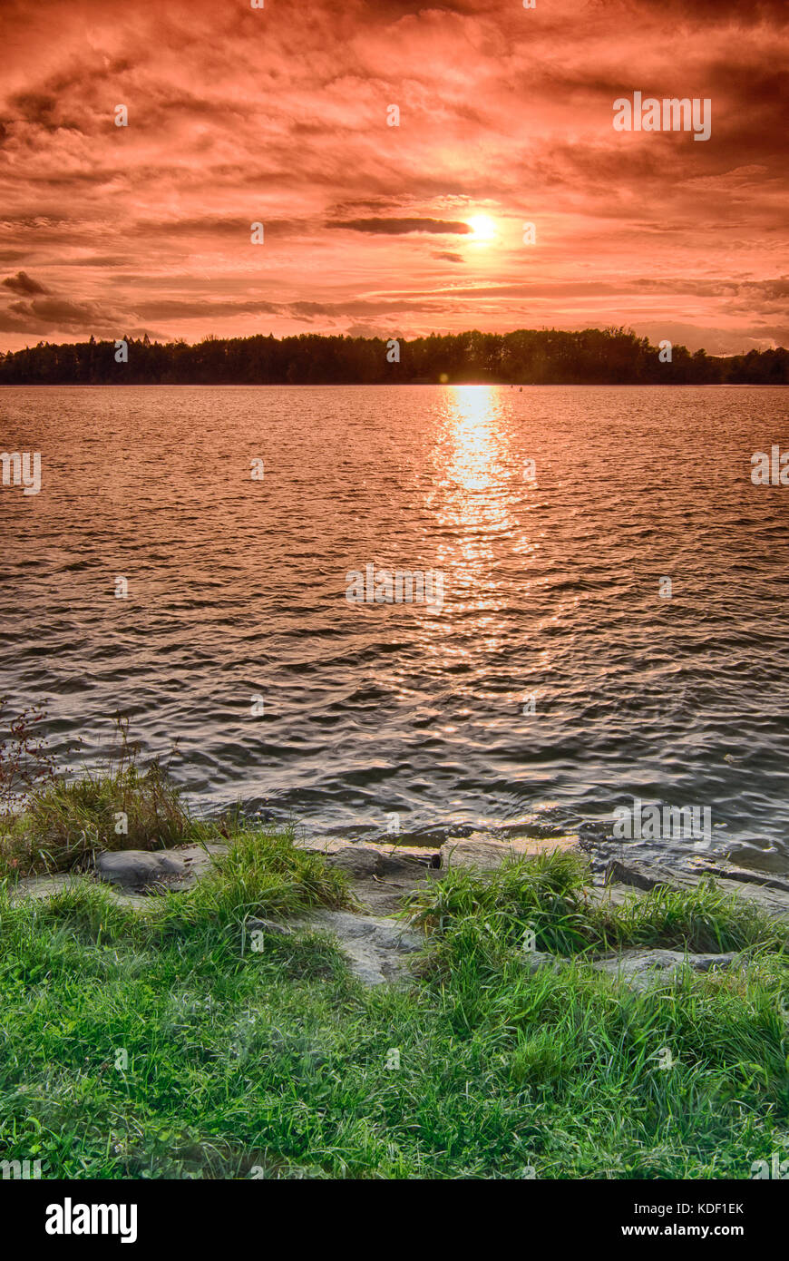 Sunset over lake Stock Photo - Alamy