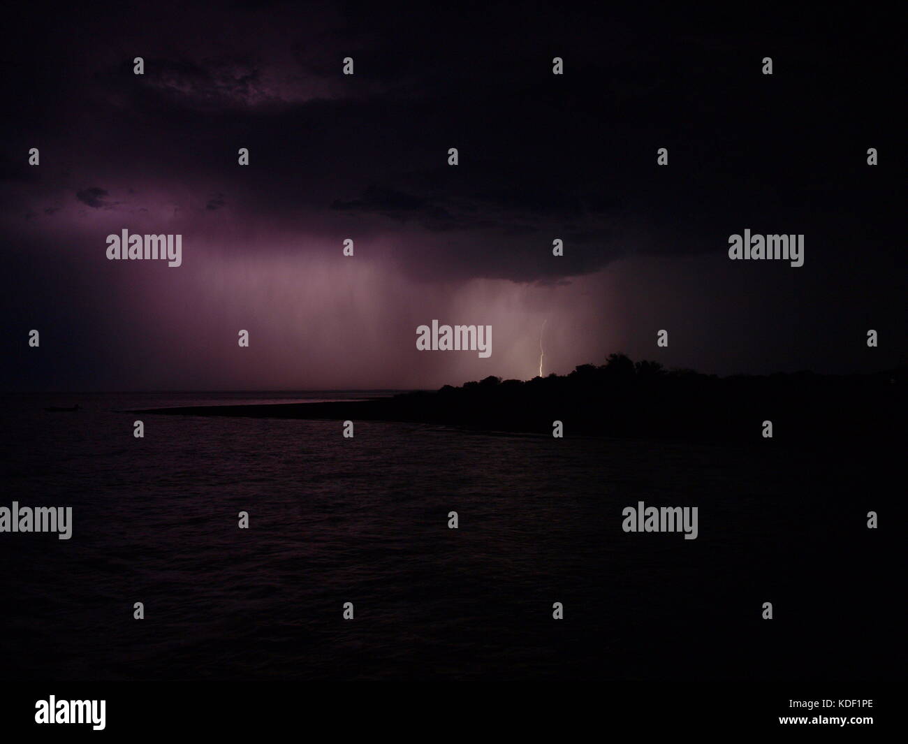 Lightning behind island hi-res stock photography and images - Alamy