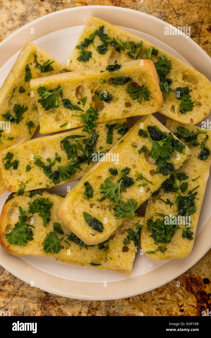 Garlic and Parsley Herbs Ciabatta Bread Sticks On A Distressed Oven or ...