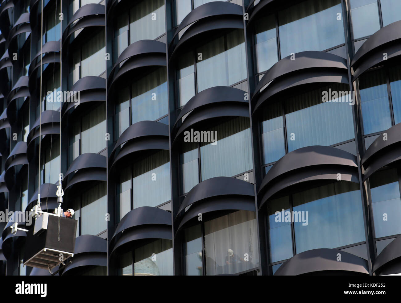 window cleaner on a tower building in barcelona Stock Photo - Alamy