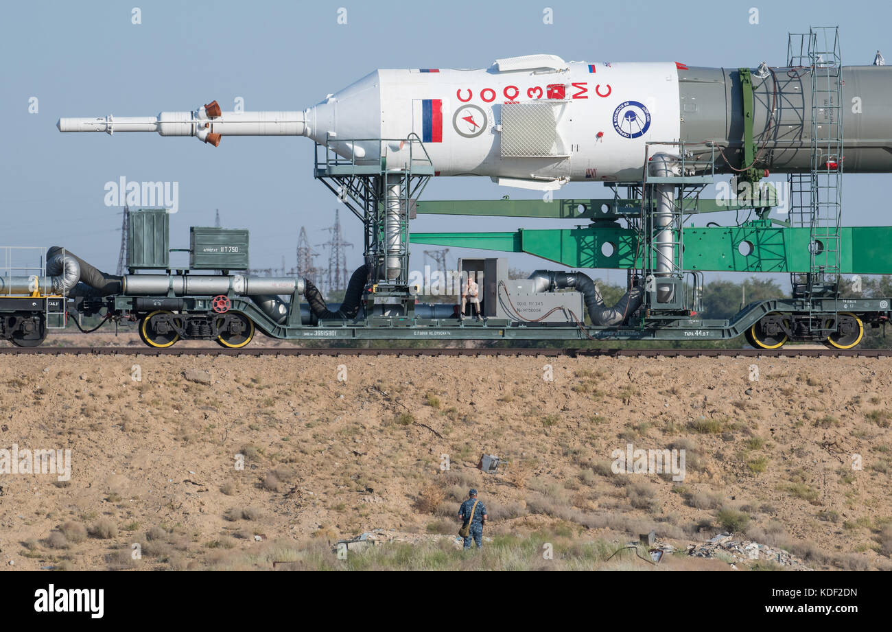 A train rolls the Soyuz MS-05 spacecraft to the Baikonur Cosmodrome ...