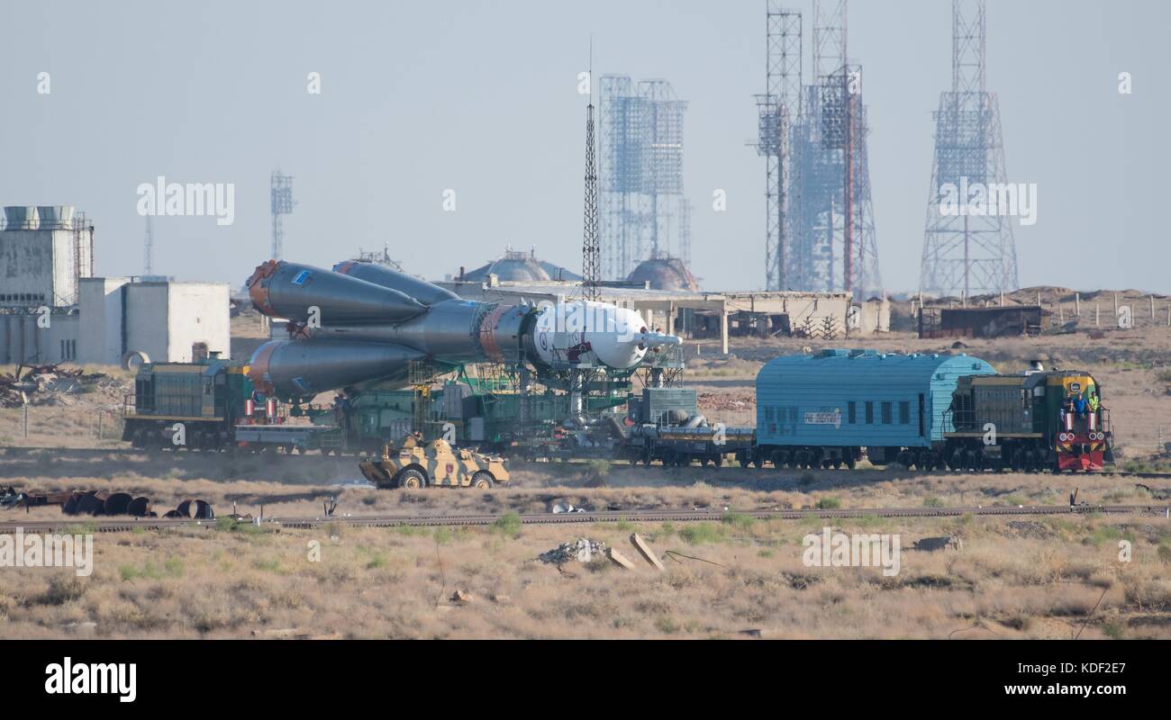 A train rolls the Soyuz MS-05 spacecraft to the Baikonur Cosmodrome ...