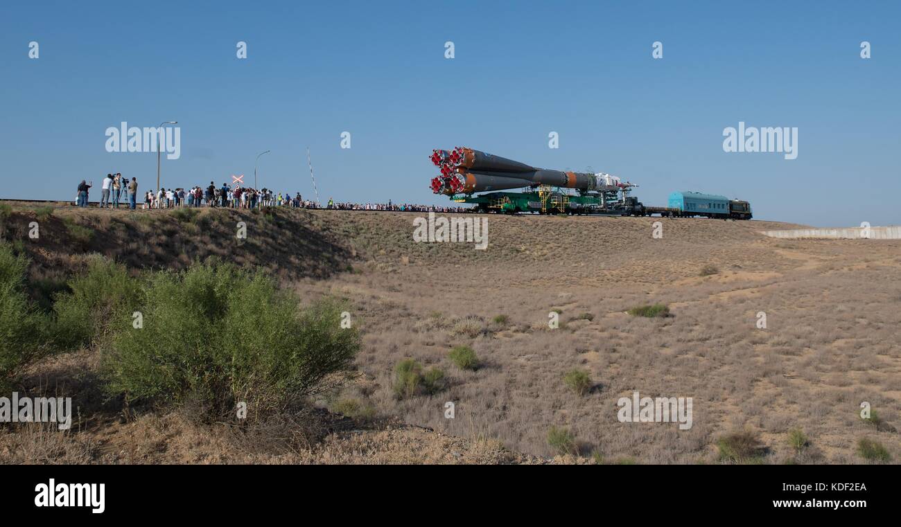 A train rolls the Soyuz MS-05 spacecraft to the Baikonur Cosmodrome ...