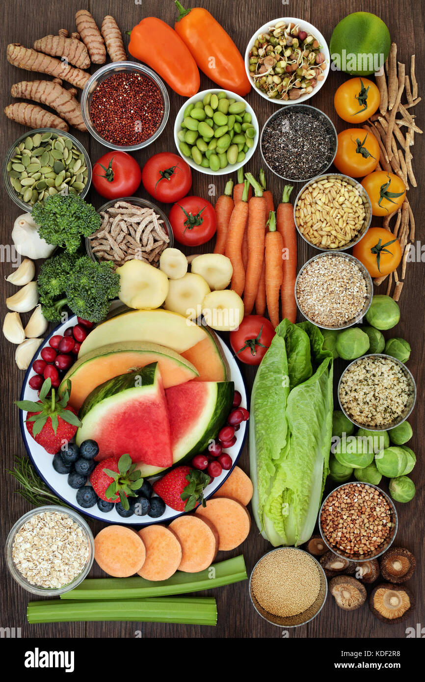 Healthy diet food concept with a selection of fruit, vegetables, seeds ...