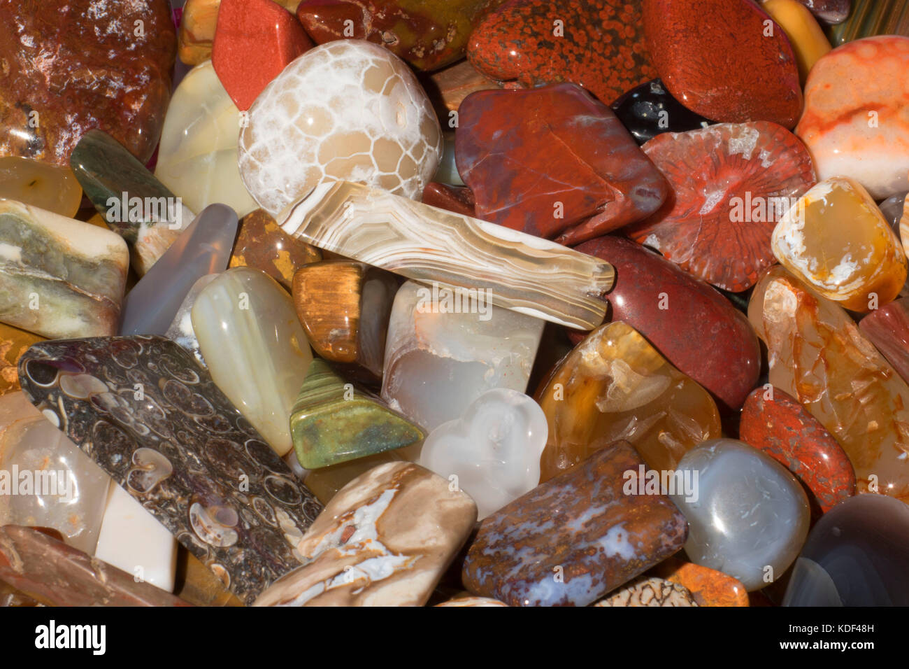 Tumbled agate and jasper Stock Photo - Alamy