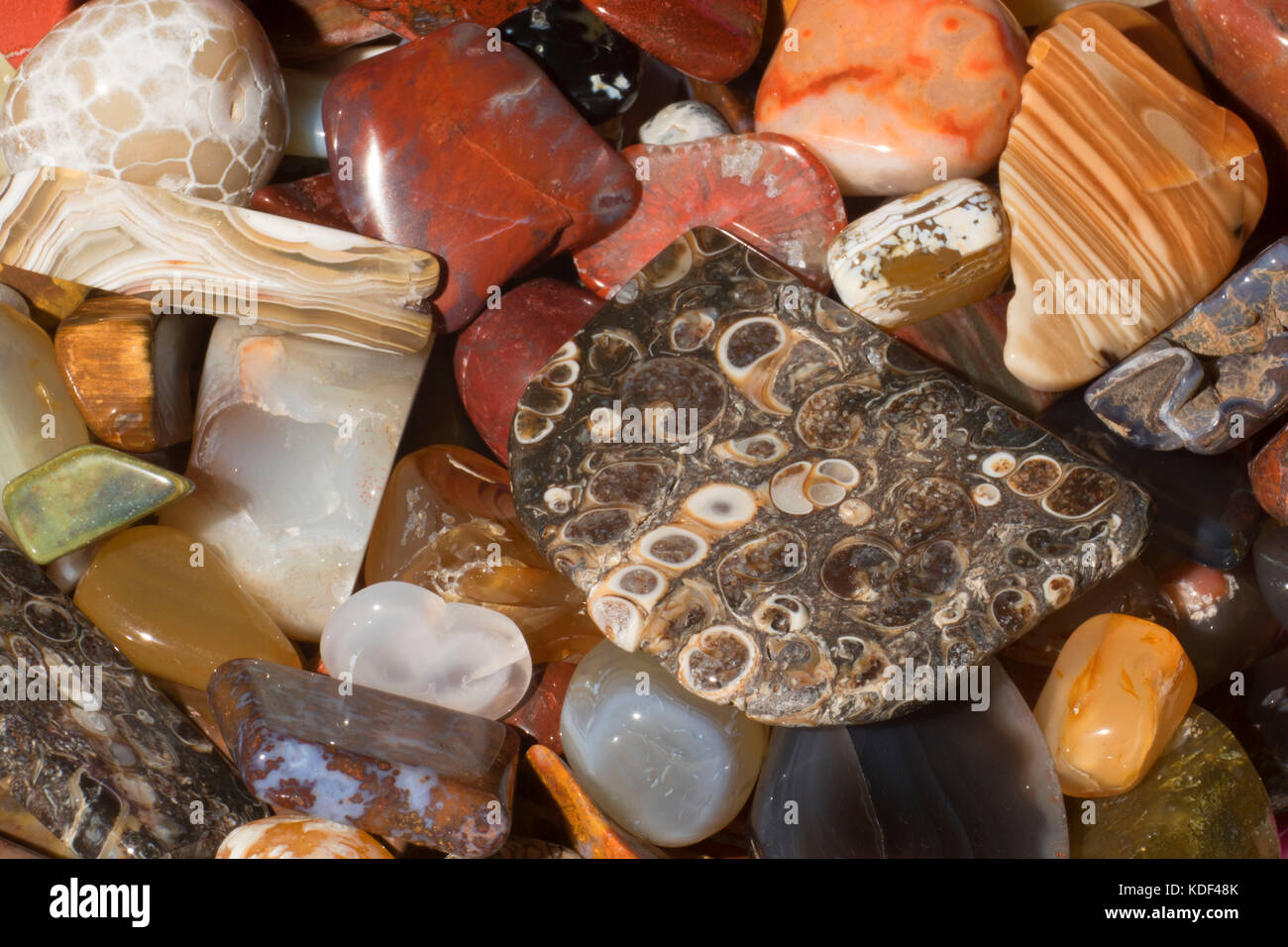 Tumbled agate and jasper Stock Photo - Alamy