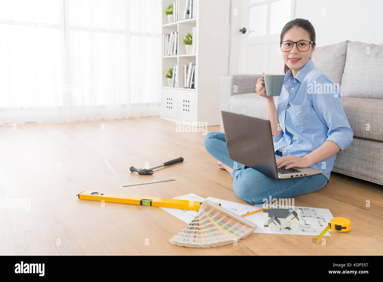 confident professional house engineer using mobile computer planning ...