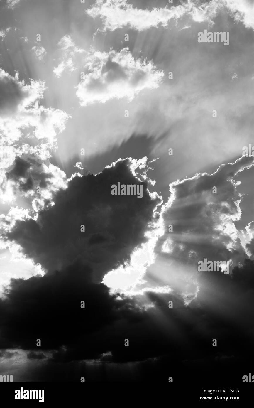 Sun coming through clouds hi-res stock photography and images - Alamy