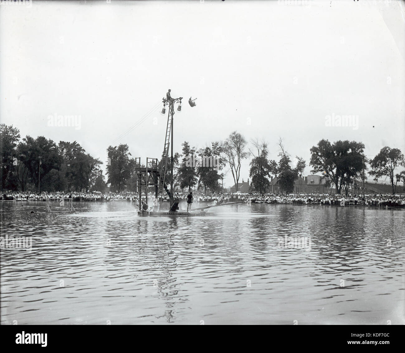 Lifeguards climb to the top of the light standard next to the diving ...