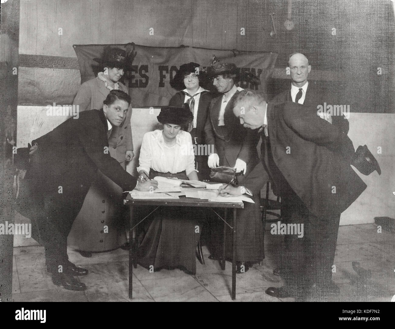 Men signing a petition supporting women's suffrage Stock Photo - Alamy