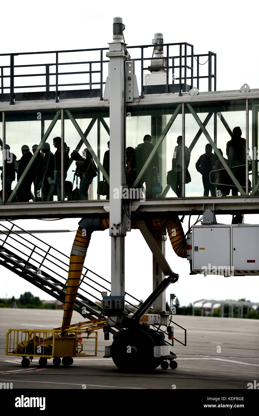 Passengers boarding on airplane through a jetway Stock Photo - Alamy