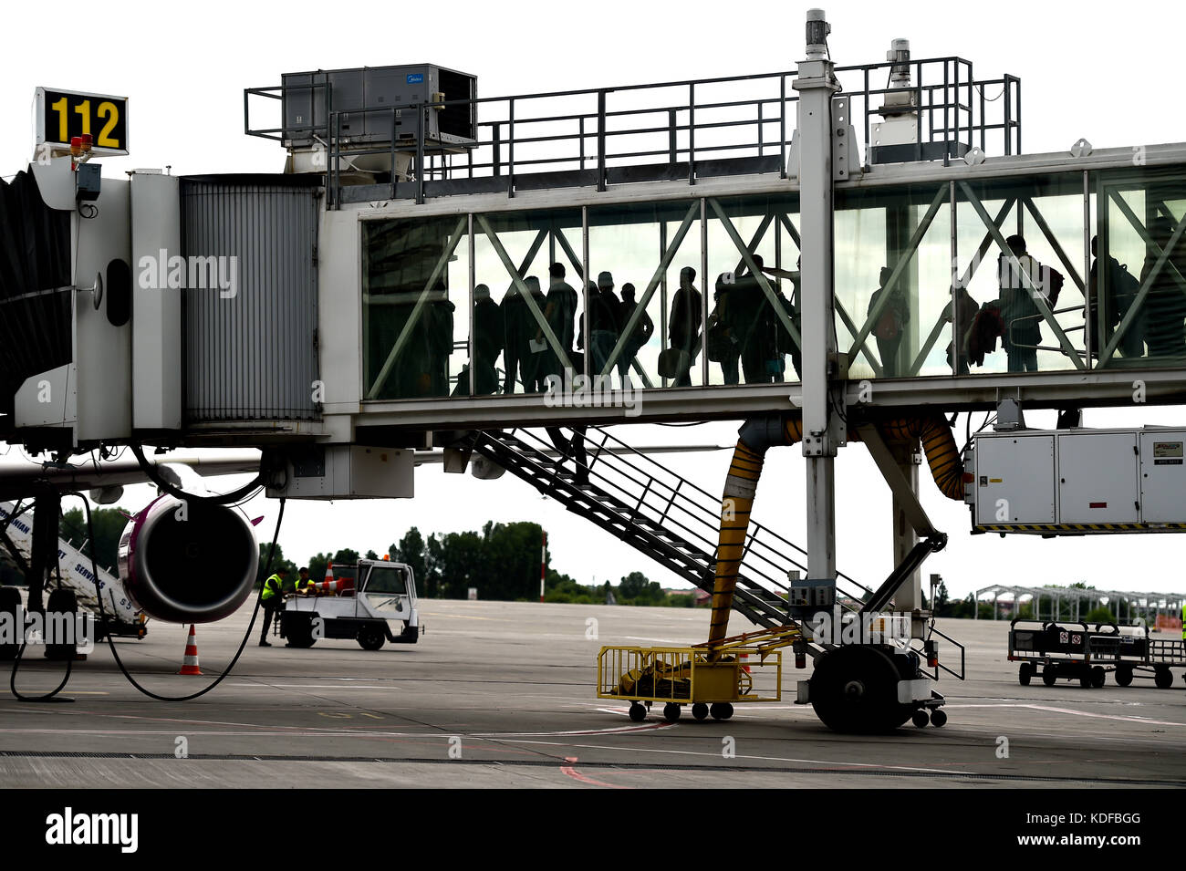 Passengers boarding on airplane through a jetway Stock Photo - Alamy