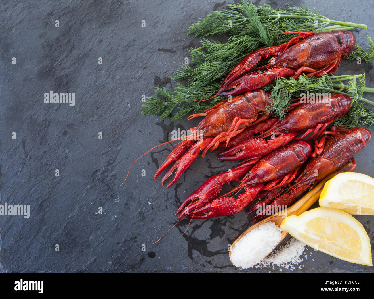 Fresh boiled crayfish on a dark slate background Stock Photo - Alamy