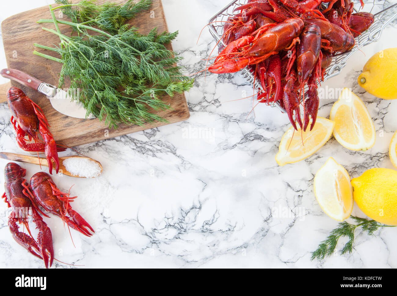 Boiled crawfish with dill and fresh lemon Stock Photo - Alamy