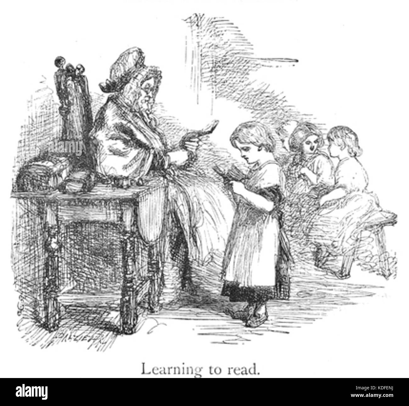 Reading to Teacher Stock Photo - Alamy