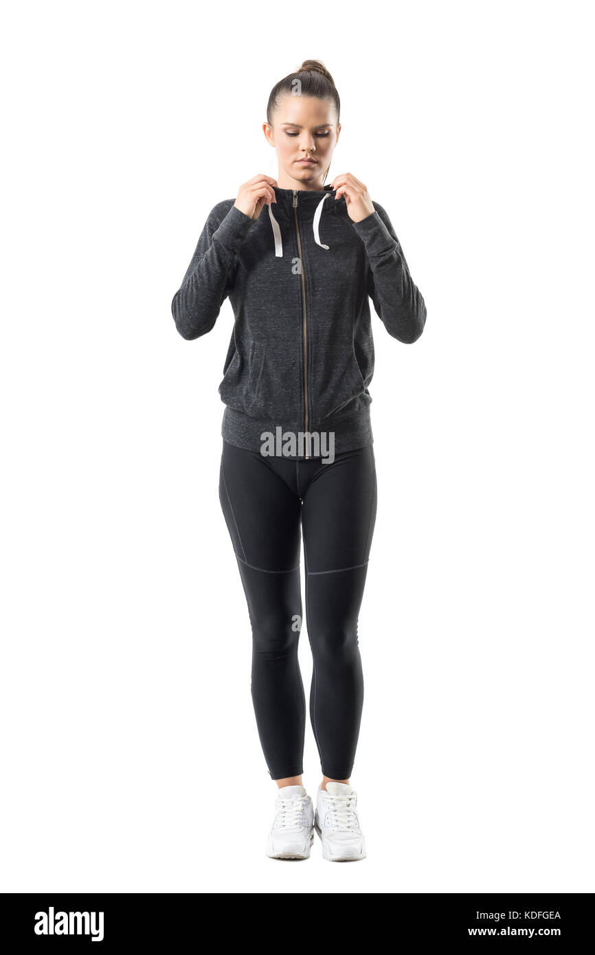 Woman runner in zip up hoodie sweatshirt get ready for running looking ...