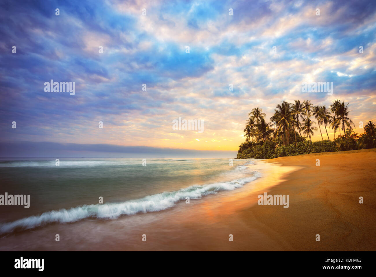Paradise Tropical beach at sunset Stock Photo - Alamy