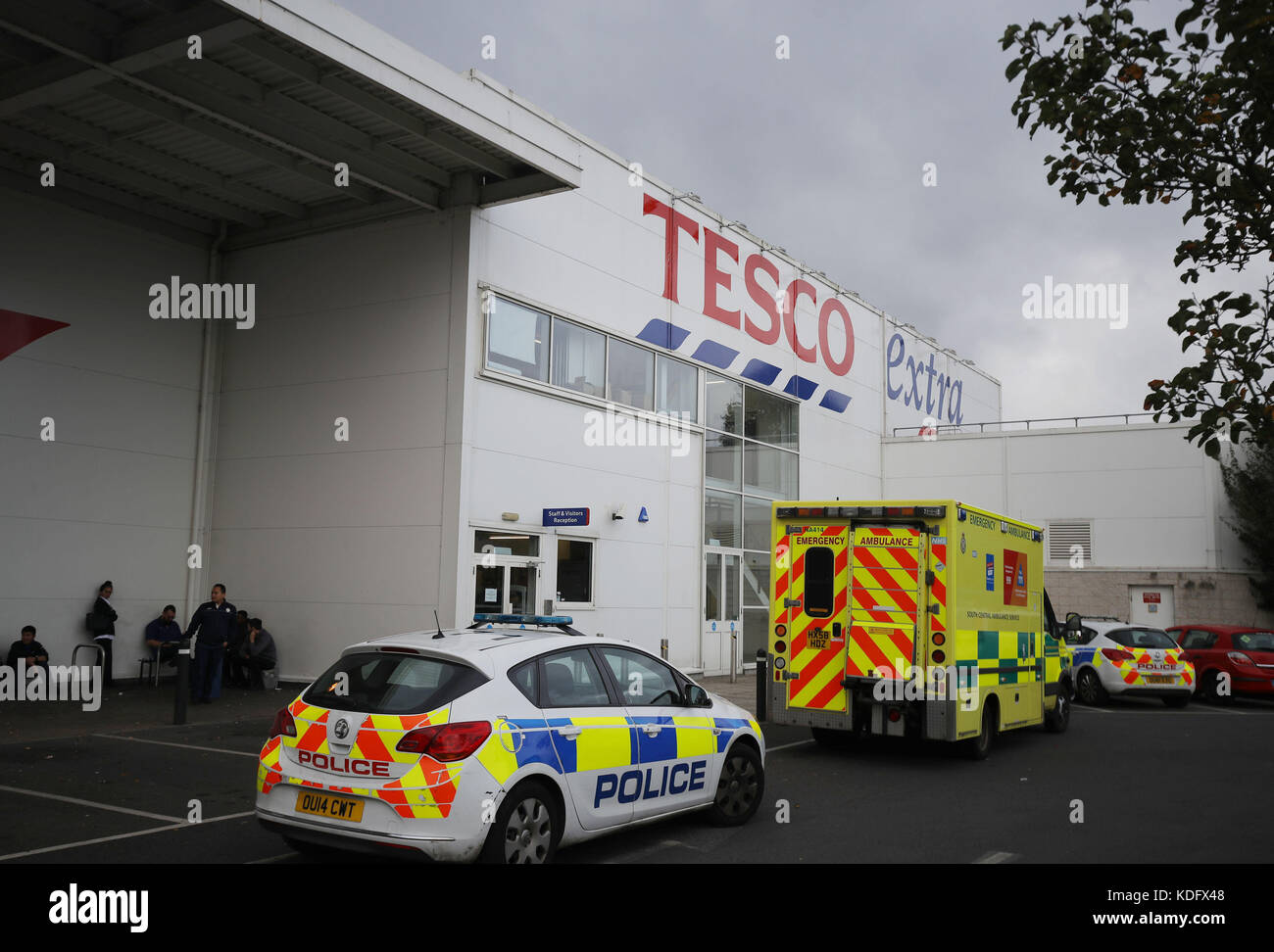 Emergency services outside a Tesco Extra store in Reading where a ...