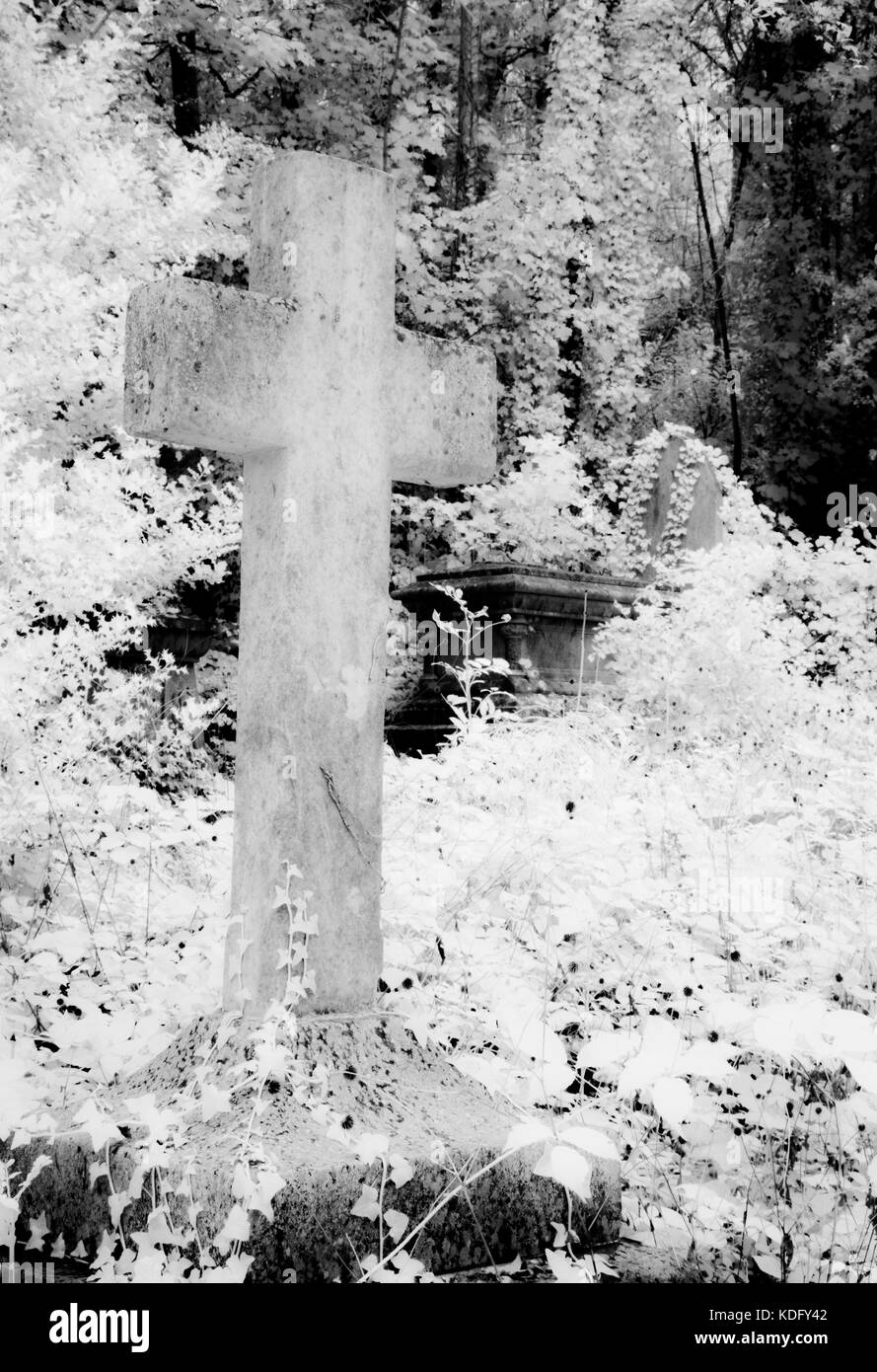 An infrared shot of an old, stone, graveyard cross Stock Photo - Alamy
