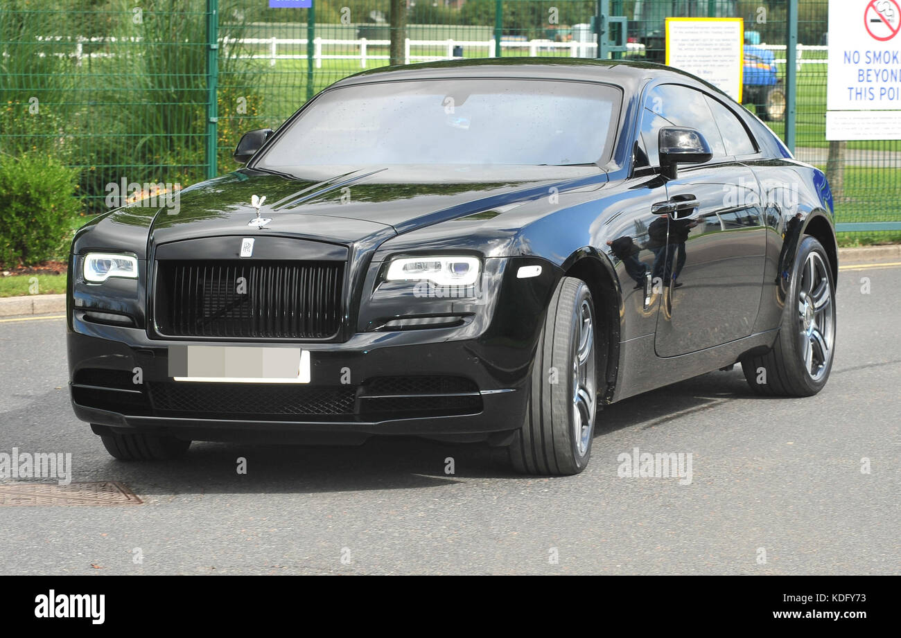 Everton football players leaving the training ground in their flashy ...