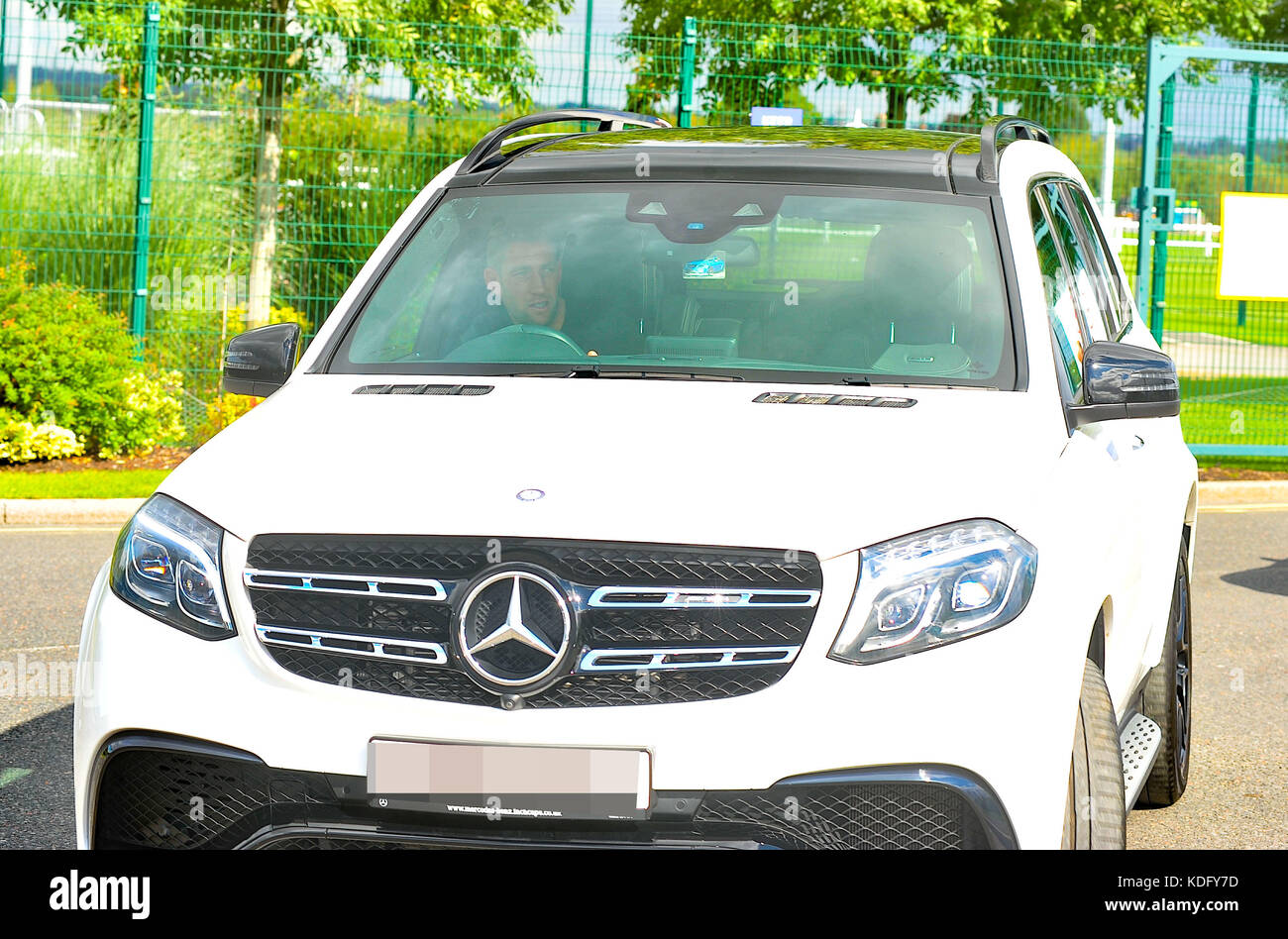 Everton football players leaving the training ground in their flashy ...