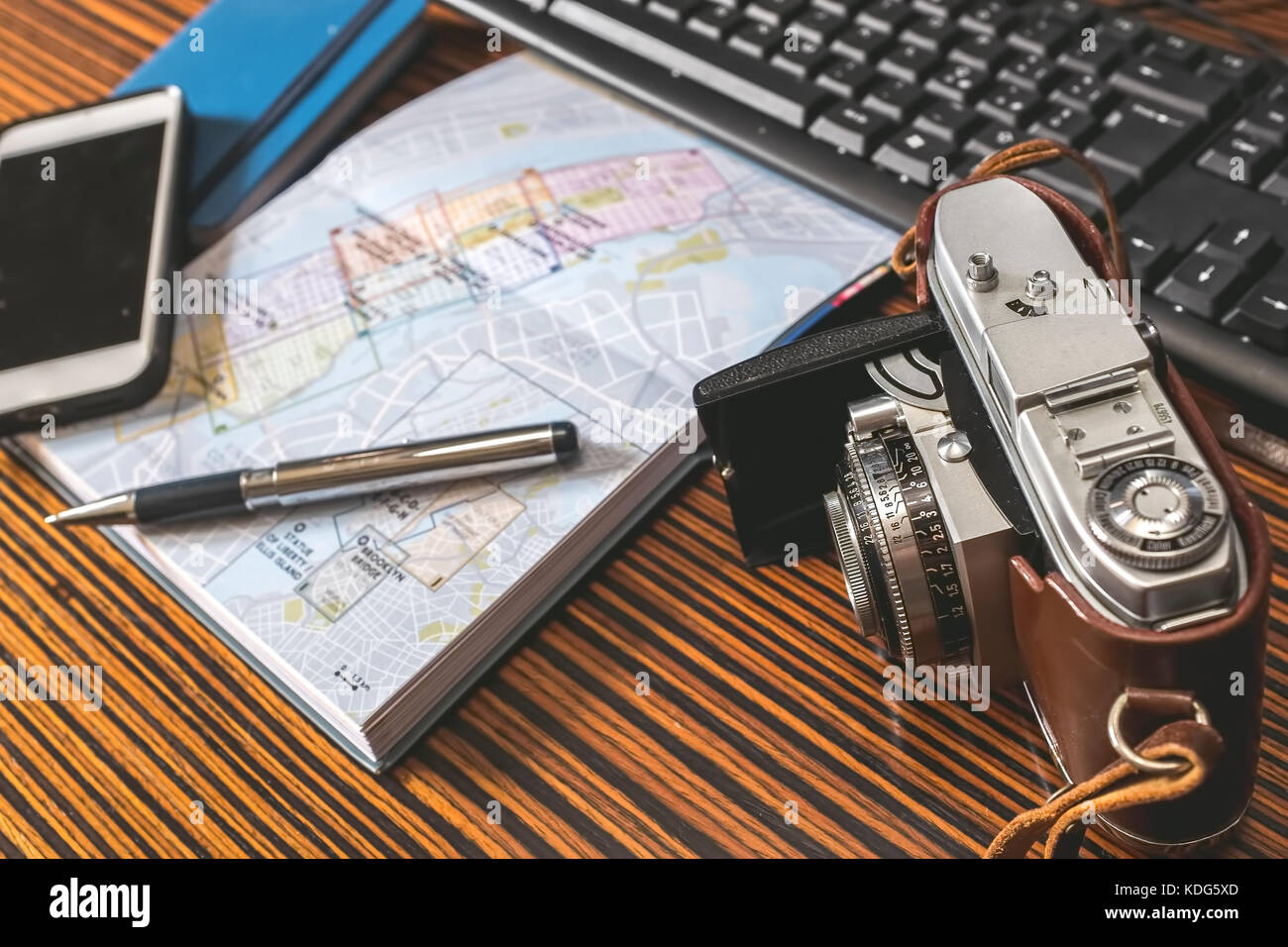 tourist's travel tools with retro style camera Stock Photo - Alamy