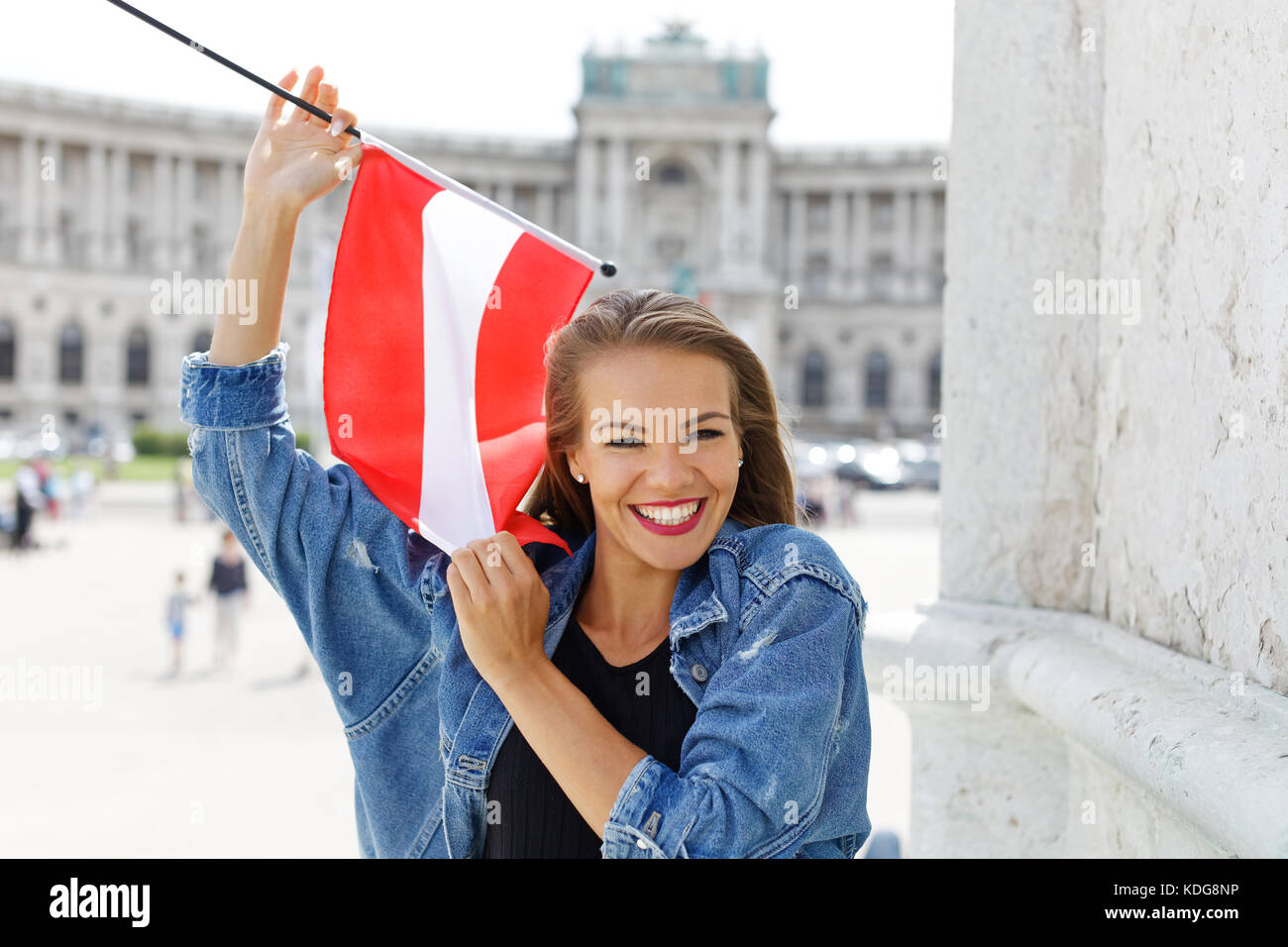 Happy young woman holding austrian flag in Vienna, Austria Stock Photo ...
