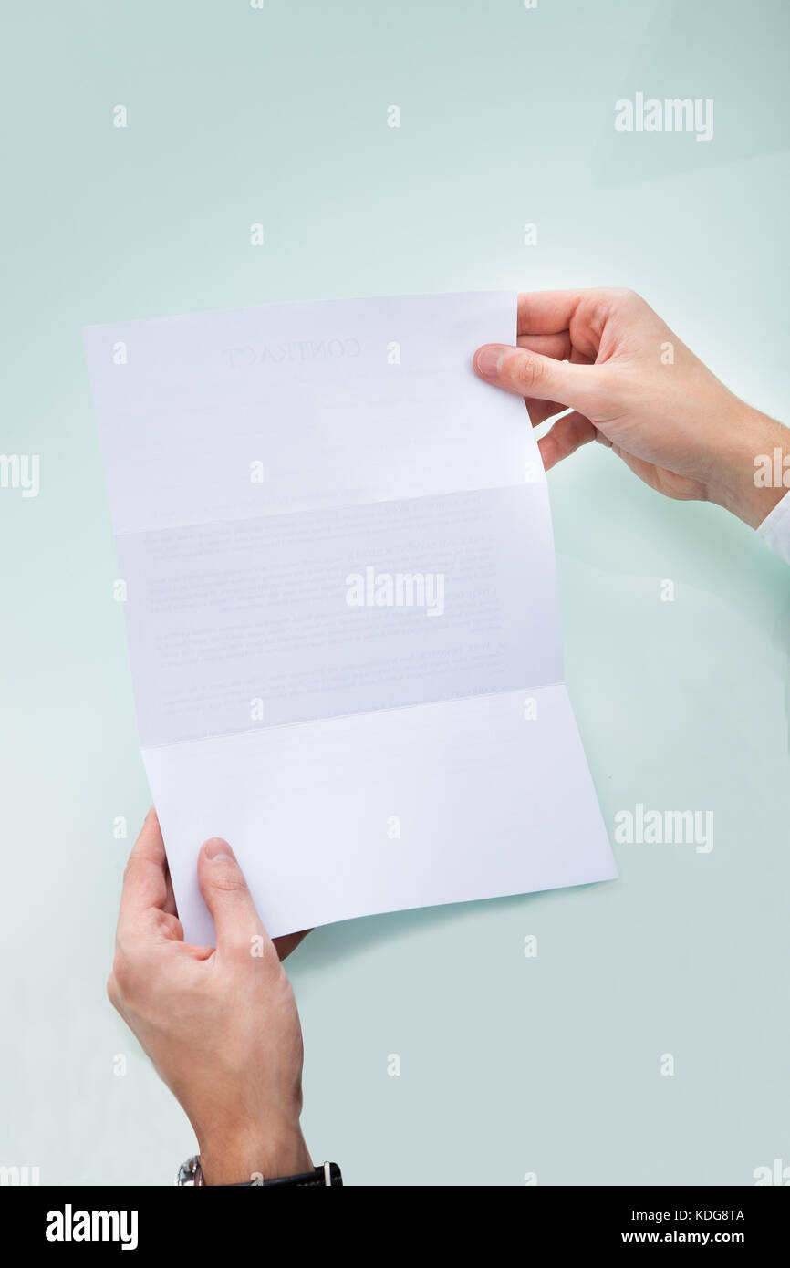 Person holding a4 paper hi-res stock photography and images - Alamy