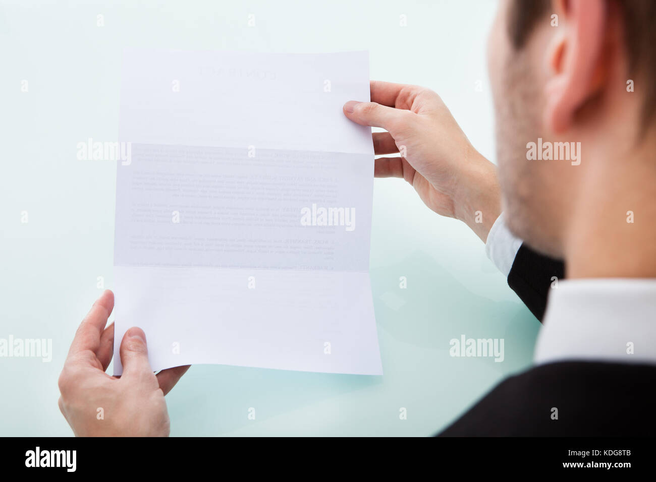 Person holding a4 paper hi-res stock photography and images - Alamy