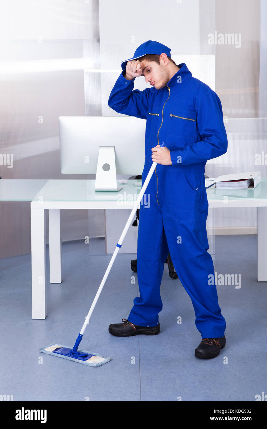 Tired worker cleaning hi-res stock photography and images - Alamy