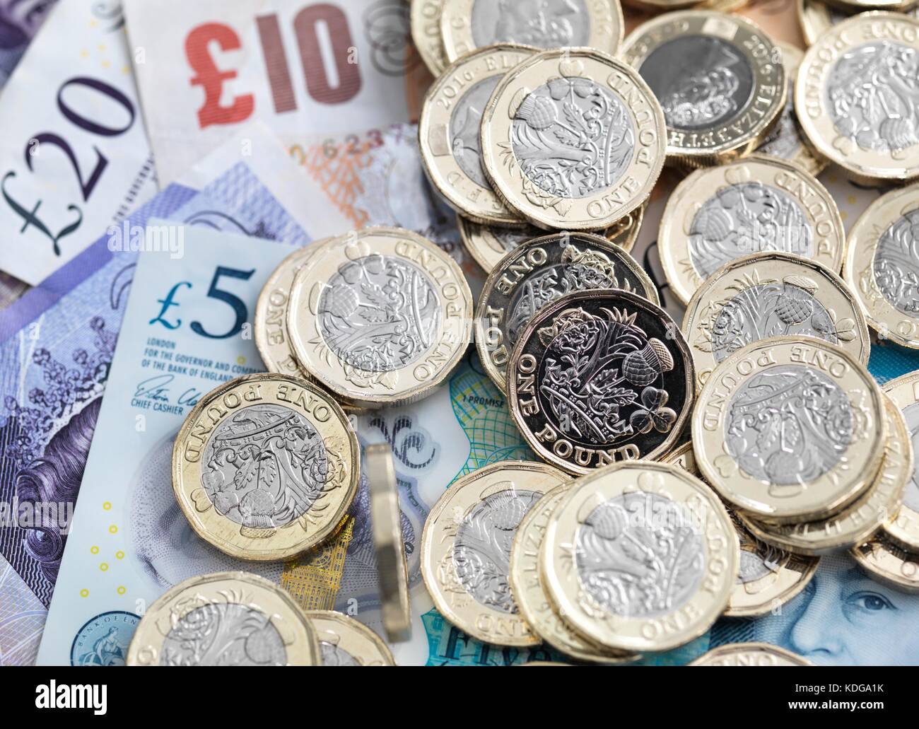 Pound coins and bank notes Stock Photo - Alamy
