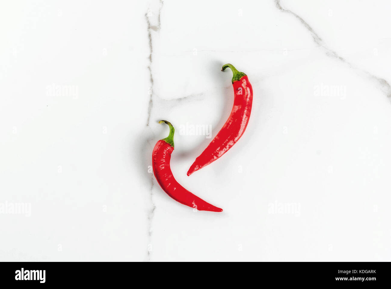 Raw fresh organic chili pepper on white marble background top view copy ...
