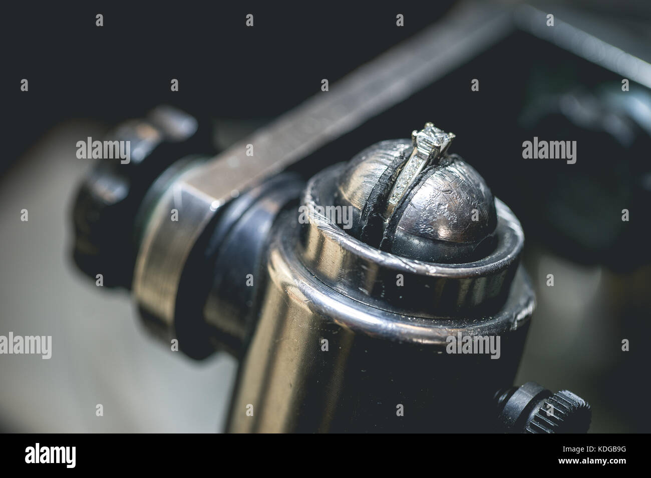 Precious diamond ring during repair and cleaning process in vice Stock ...