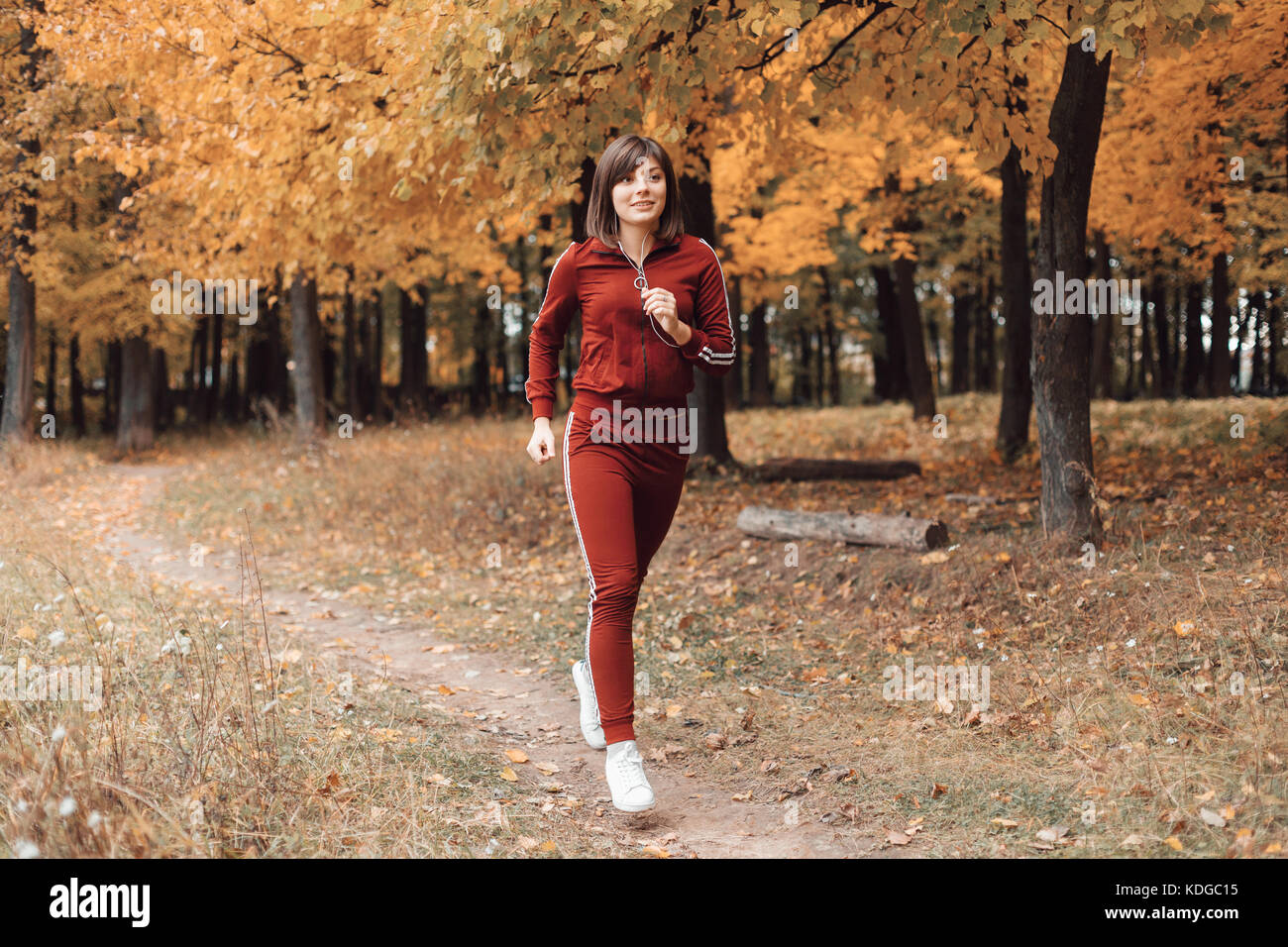 Healthy lifestyle. athletic girl running in the Park and doing ...