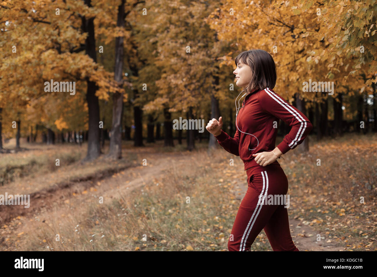 Healthy lifestyle. athletic girl running in the Park and doing ...