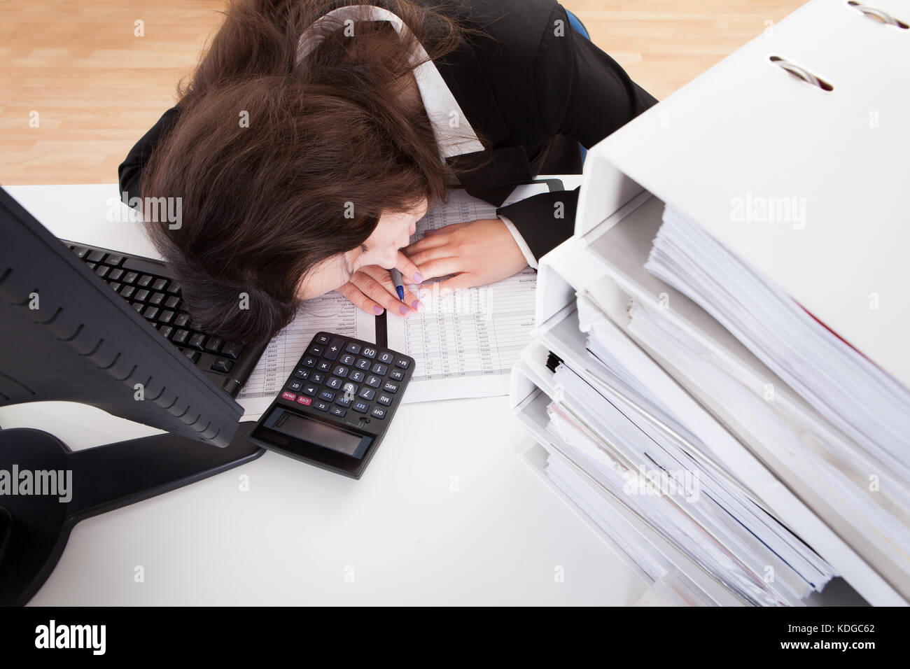 Stressed Businesswoman Sleeping In Office With Stack Of Folders Stock ... Stressed Businesswoman Sleeping In Office With Stack Of Folders Stock ...