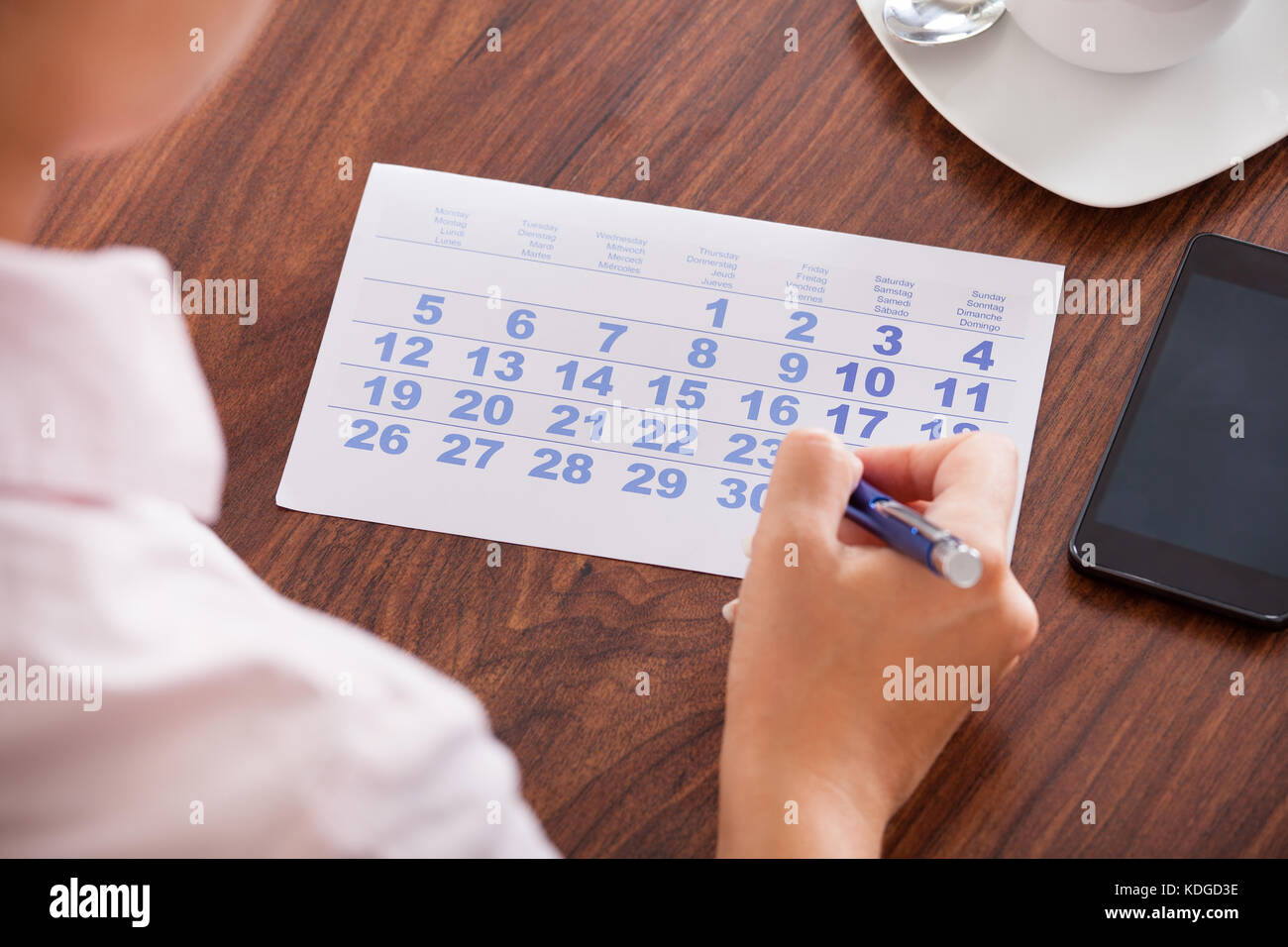 Close-up Of Businesswoman Marking A Day On Calendar Stock Photo - Alamy
