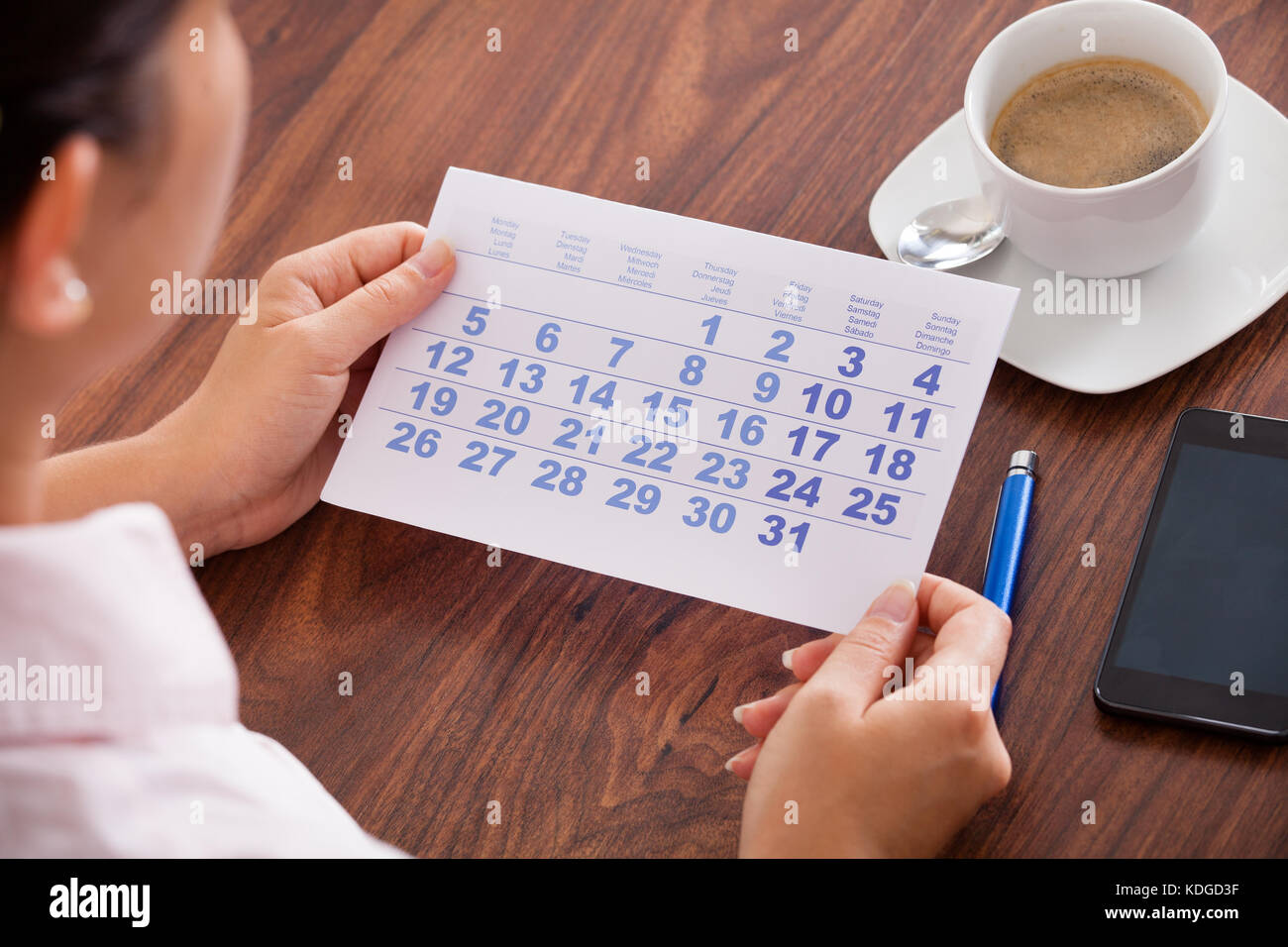Close-up Of Businesswoman Marking A Day On Calendar Stock Photo - Alamy