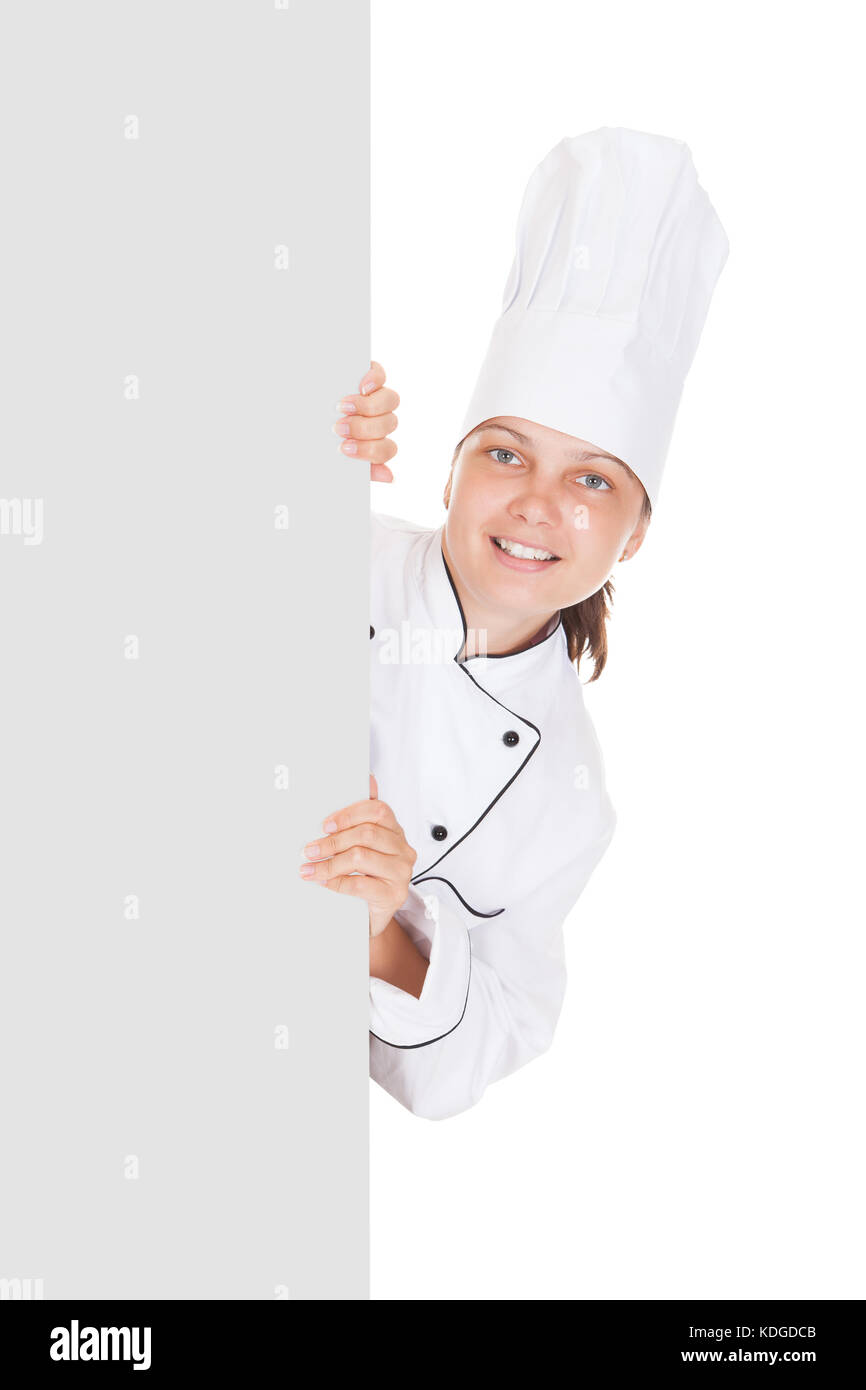 Female chef pointing on blank placard over white background Stock Photo ...