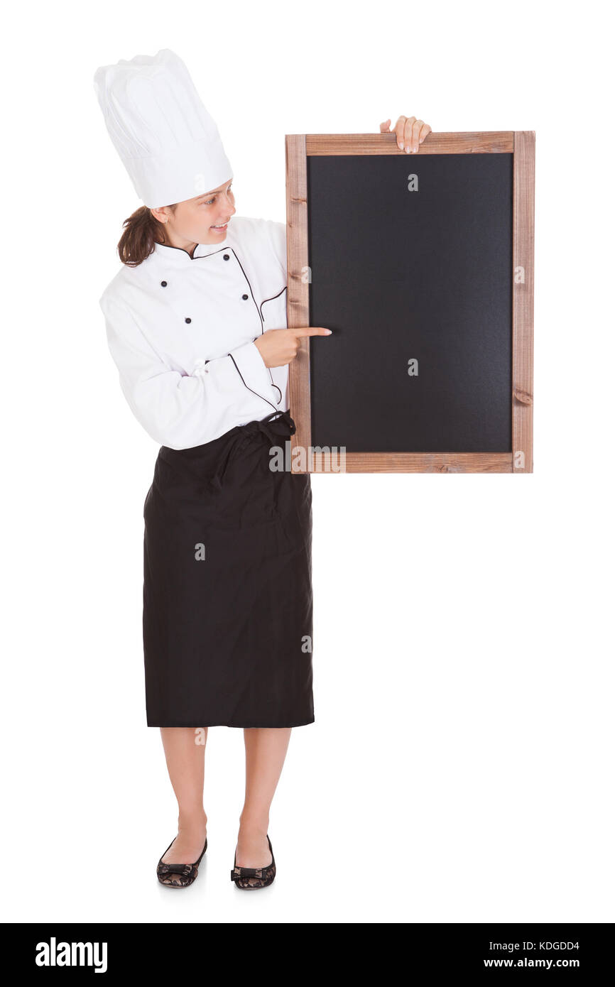 Happy female chef holding blank menu board on white background Stock ...
