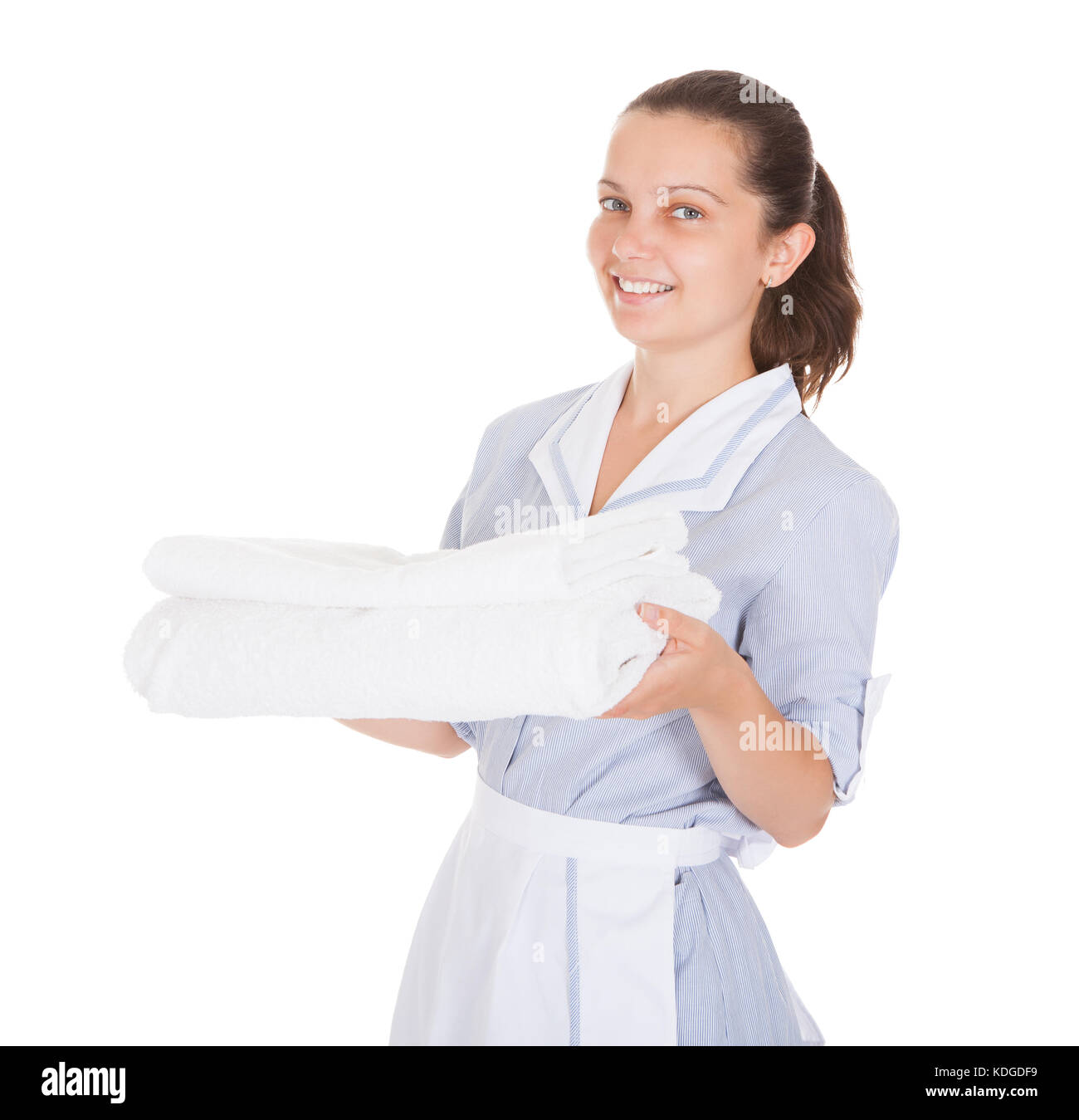 Young Maid Holding Towels Over White Background Stock Photo - Alamy