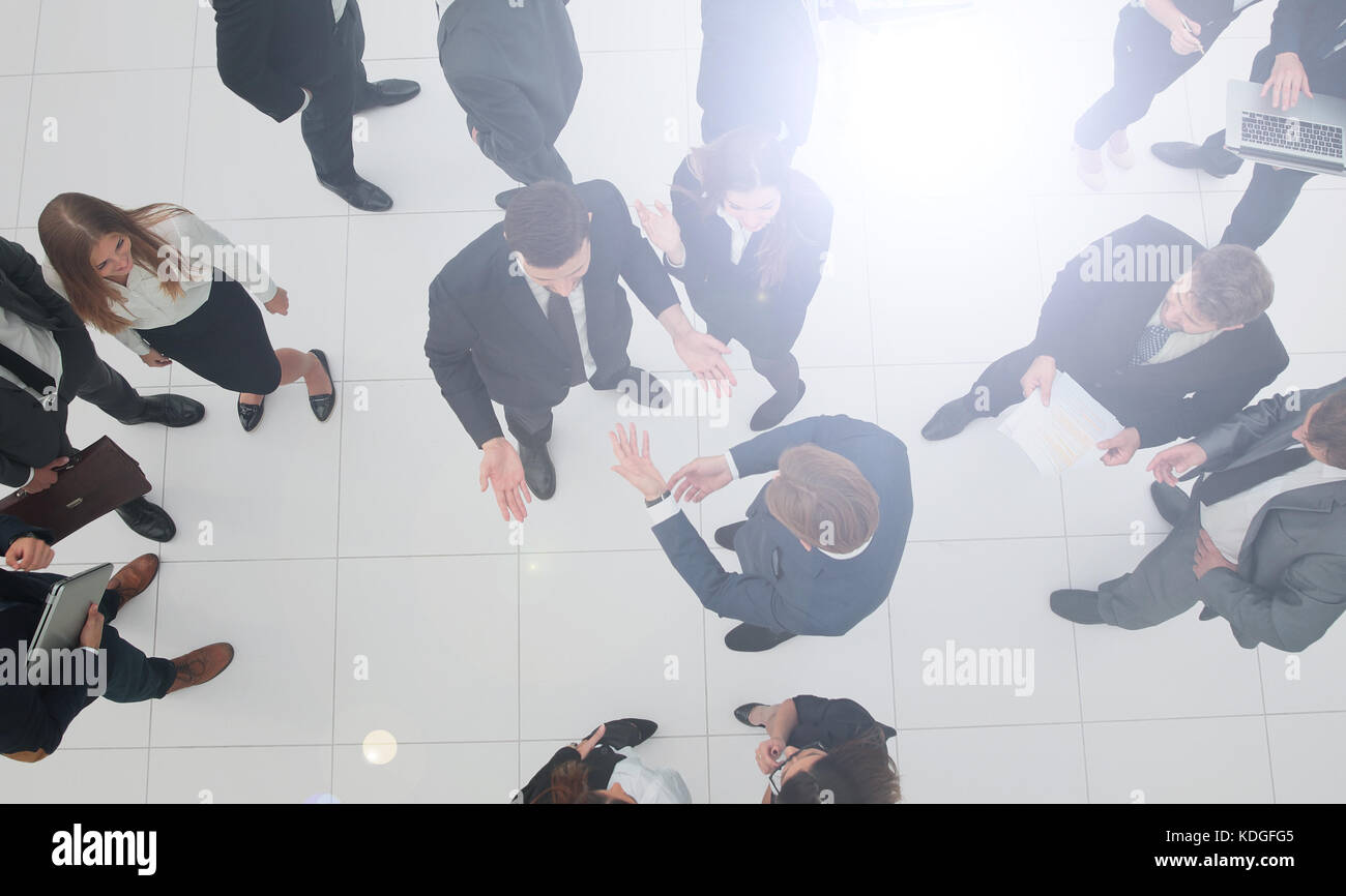 Elevated view of large group of multiethnic business people talk Stock ...
